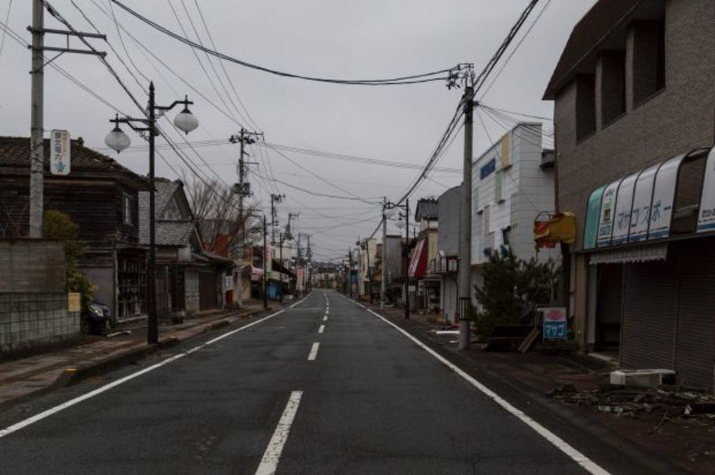 Fukushima's lonely radioactive towns still hold eerie signs of former ...