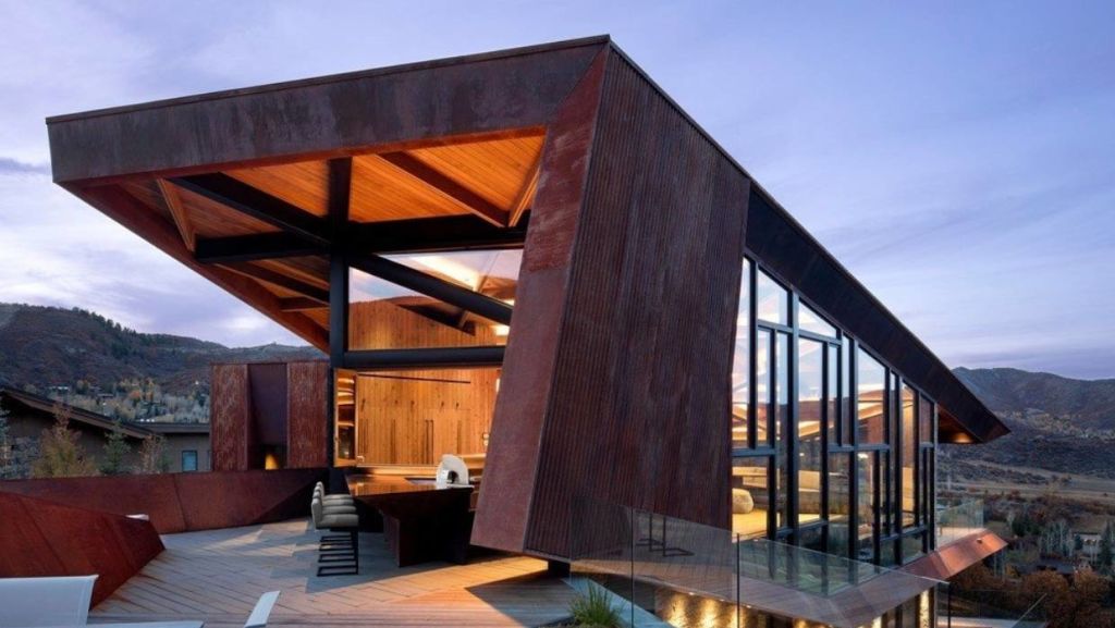 Architectural mountain house that takes its cue from the surrounding ...