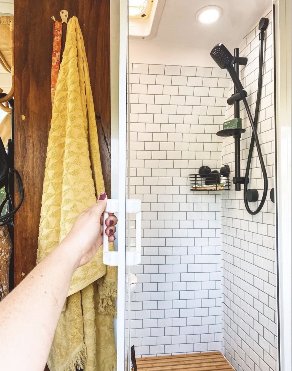 This young couple converted a $15,000 Toyota Coaster into their first home