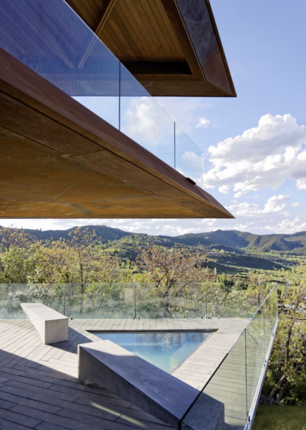 Architectural mountain house that takes its cue from the surrounding ...