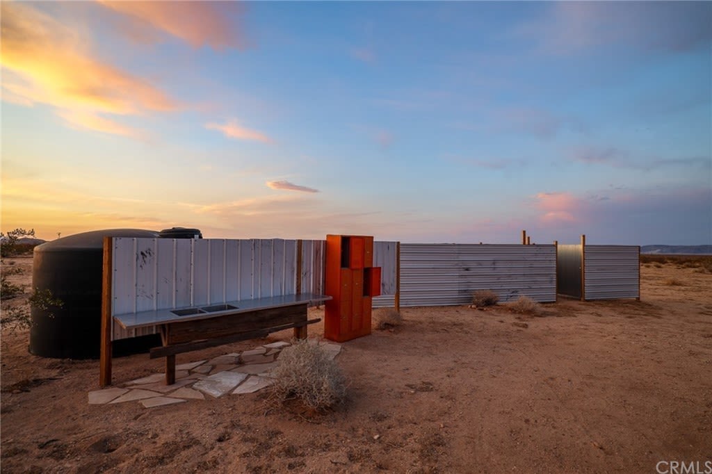 House in the middle of the desert with no walls or utilities listed for ...