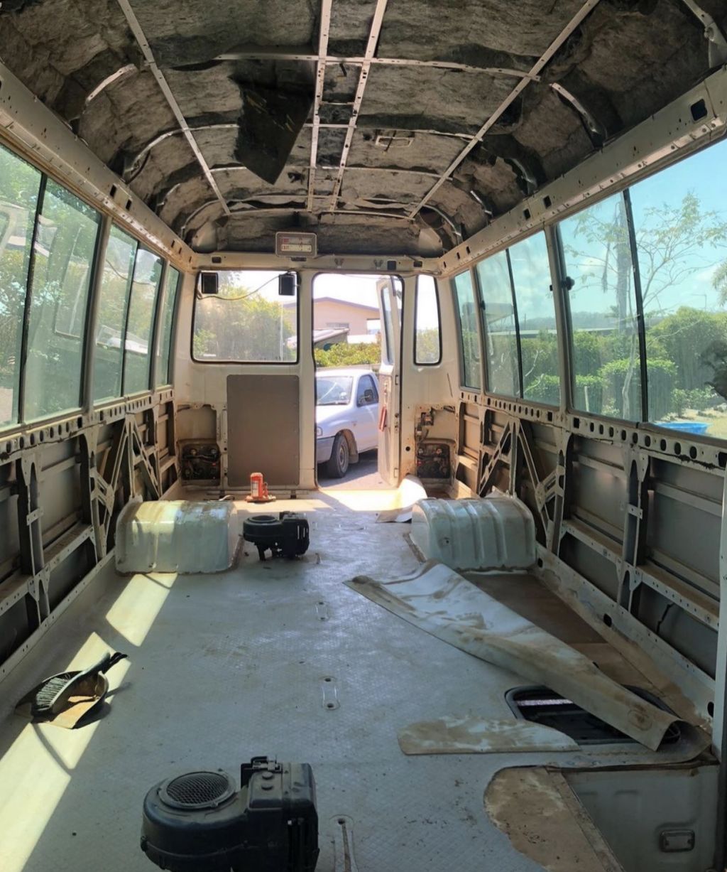 This young couple converted a $15,000 Toyota Coaster into their first home