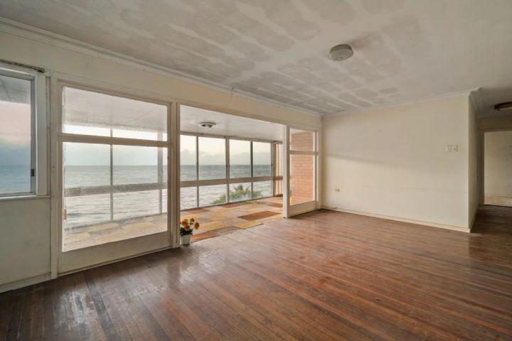 Buyers can't resist this Redcliffe beach house – and it's not because ...