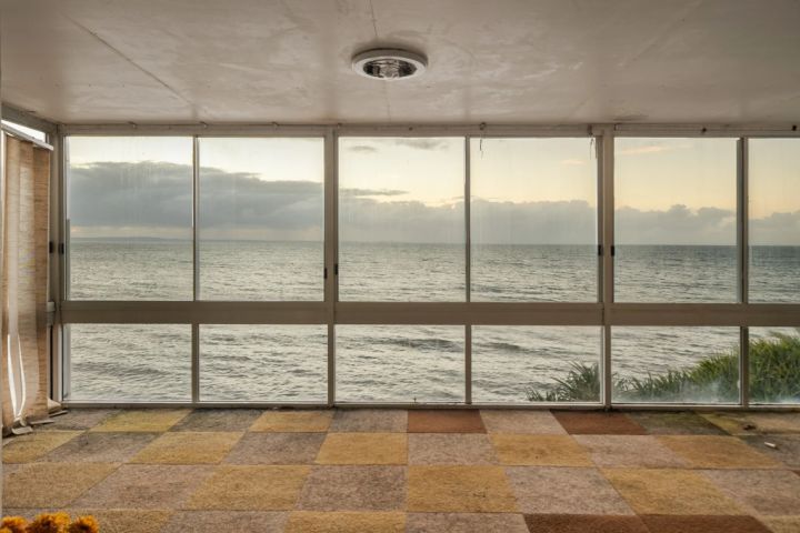 Buyers can't resist this Redcliffe beach house – and it's not because ...